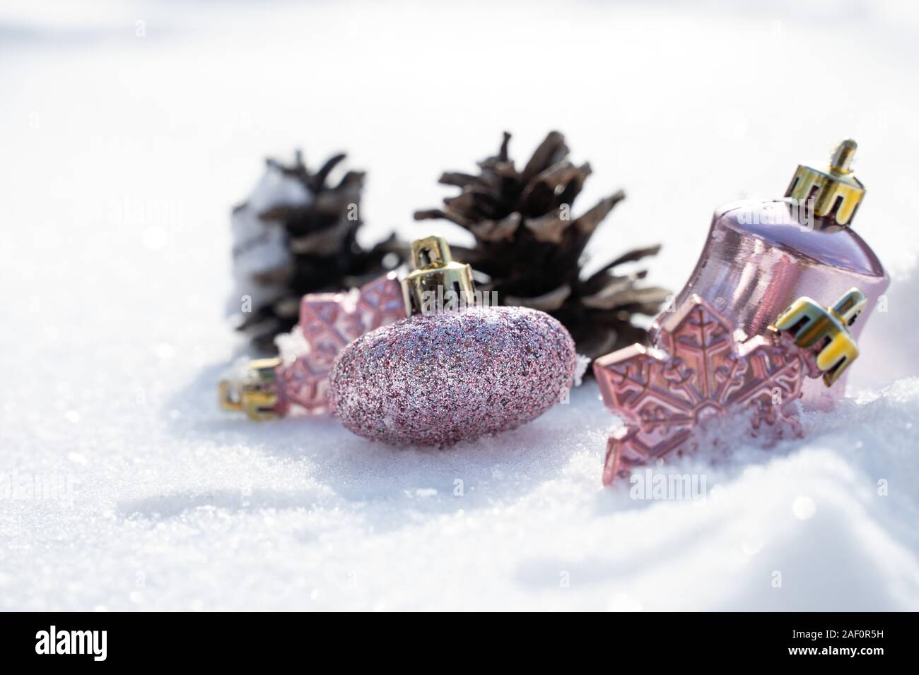 Pink Christmas of winter - Christmas balls with ribbon on snow, Winter ...