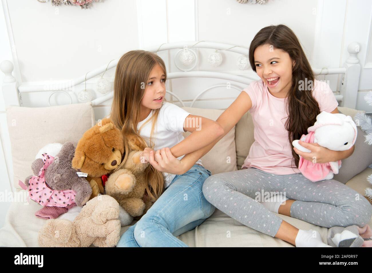 Learn basics of conflict through game. Little girls play game at home ...