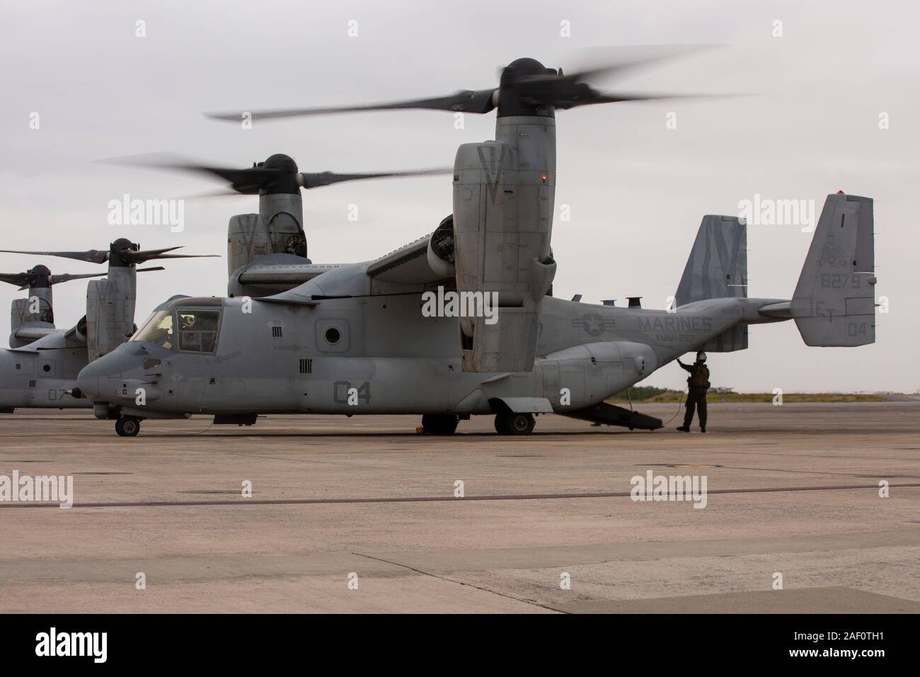 U.S. Marine Corps Cpl. Dakota J. Bingen prepares an MV-22 Osprey for ...