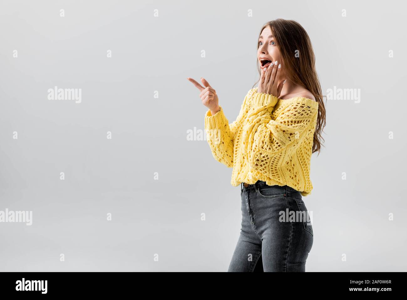 Surprised girl pointing on face hi-res stock photography and images - Alamy