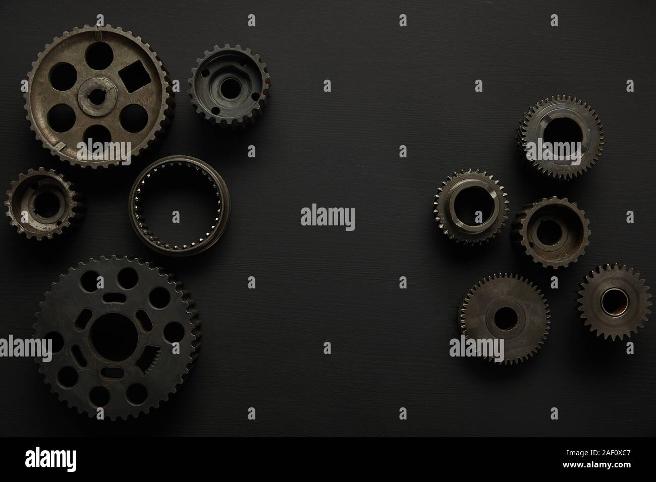 top view of aged gears on black surface Stock Photo - Alamy