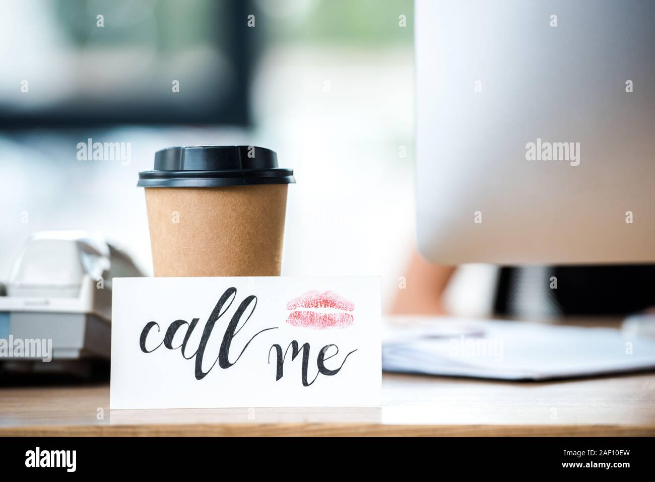 card with call me lettering near paper cup in office Stock Photo - Alamy