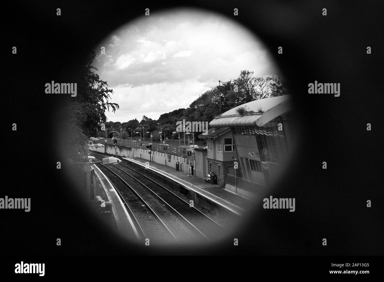 Railways looked through a small hole Stock Photo - Alamy