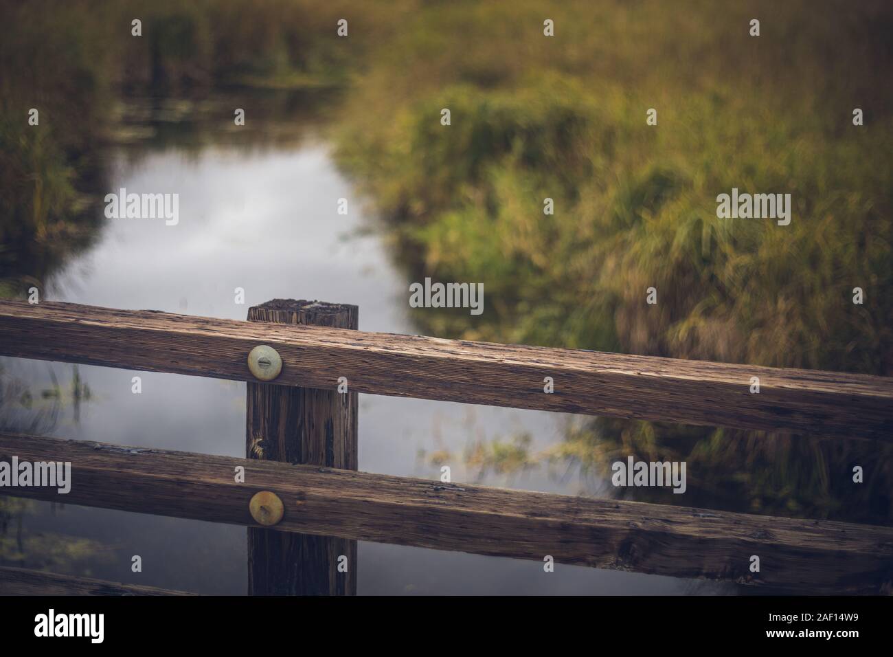 Wooden Bridge Over Stream Stock Photo - Alamy