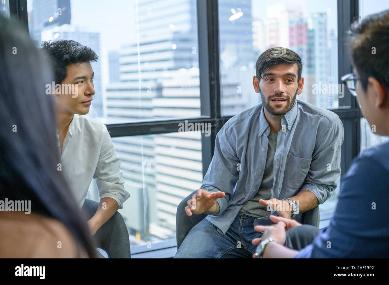 Psychotherapist inquiring about symptoms occurring within mind from ...