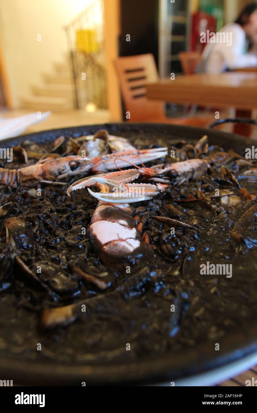 Black squid ink paella hi-res stock photography and images - Alamy