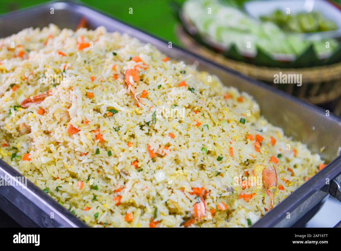 Thai food buffet fried rice shrimp carrot and vegetables on tray in the ...