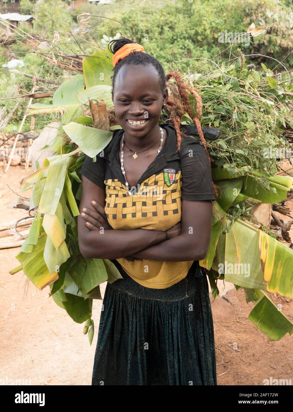 A Young Happy Laughing Ethiopian Konso Tribe Young Woman Carrying ...