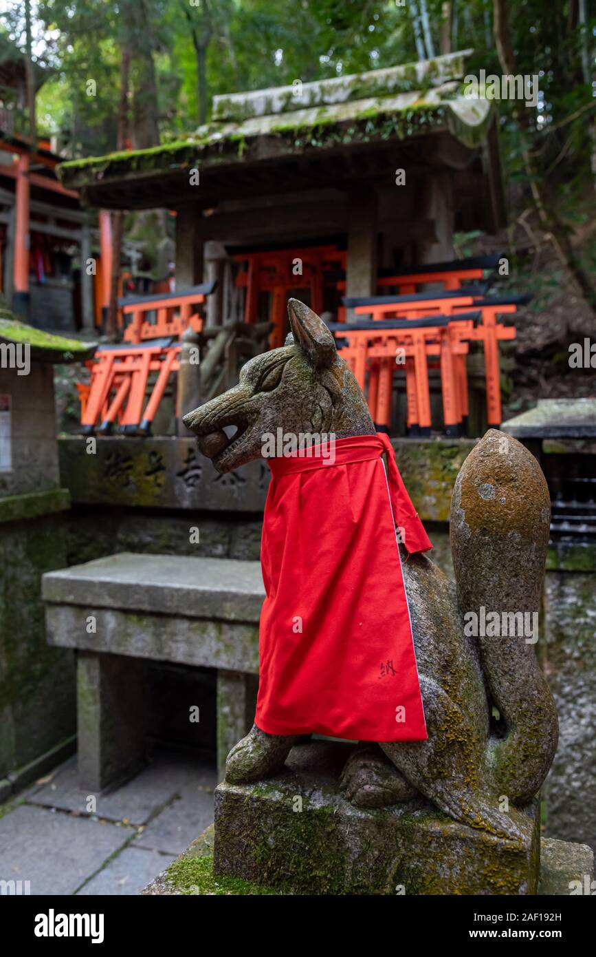 April, 12. 2019: Offerings of red torii gates and fox sculptures ...