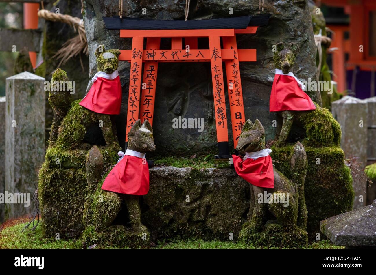 April, 12. 2019: Offerings of red torii gates and fox sculptures ...