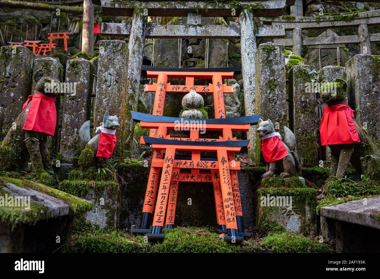 April, 12. 2019: Offerings of red torii gates and fox sculptures ...