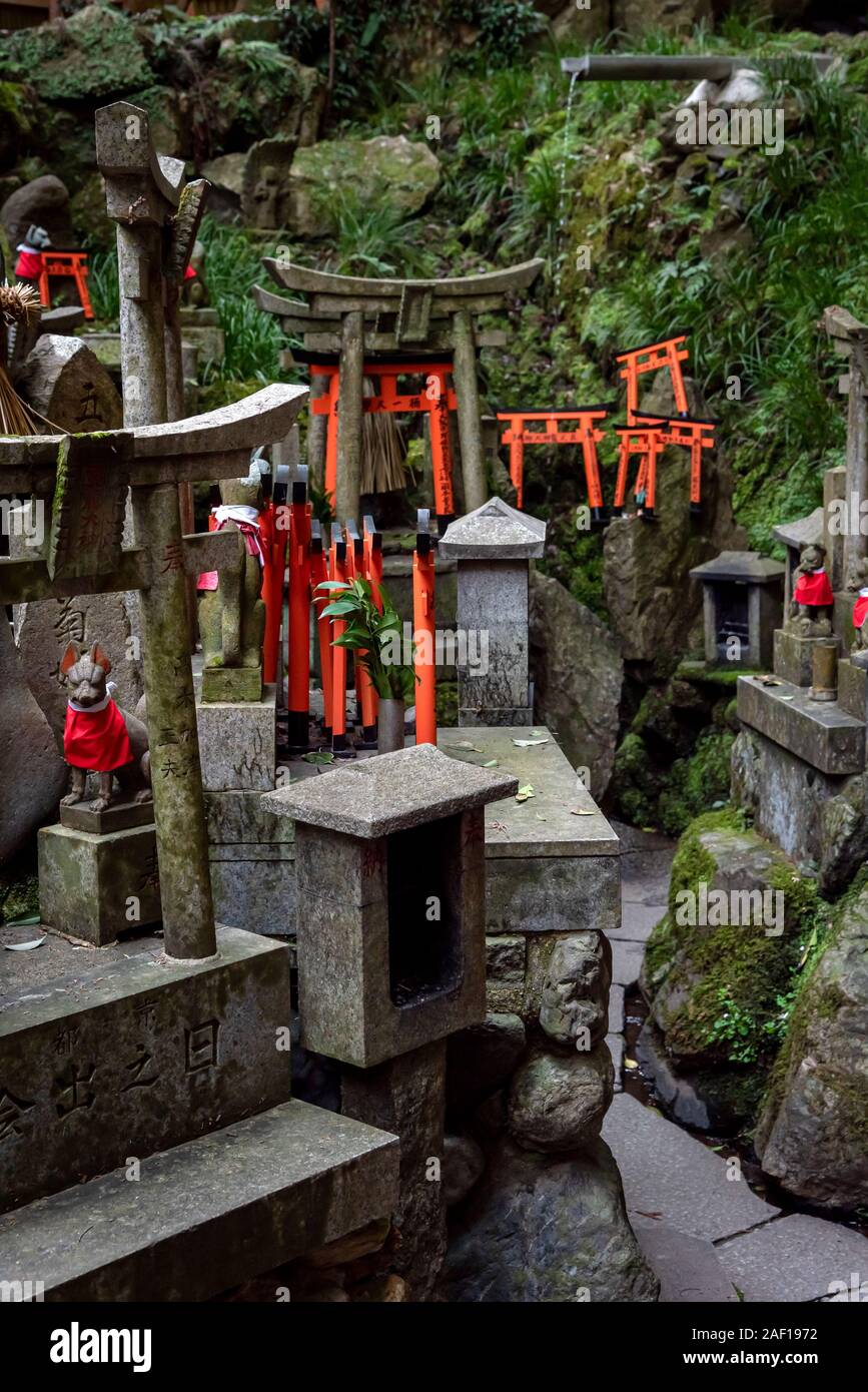 April, 12. 2019: Offerings of red torii gates and fox sculptures ...