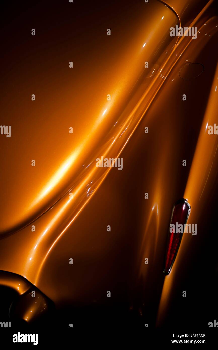 Curved lines and body shapes of a vintage retro rarity car with a ...