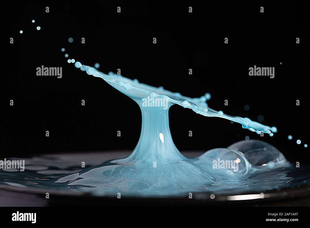 High resolution high megapixel image of a water drop splash with blue ...
