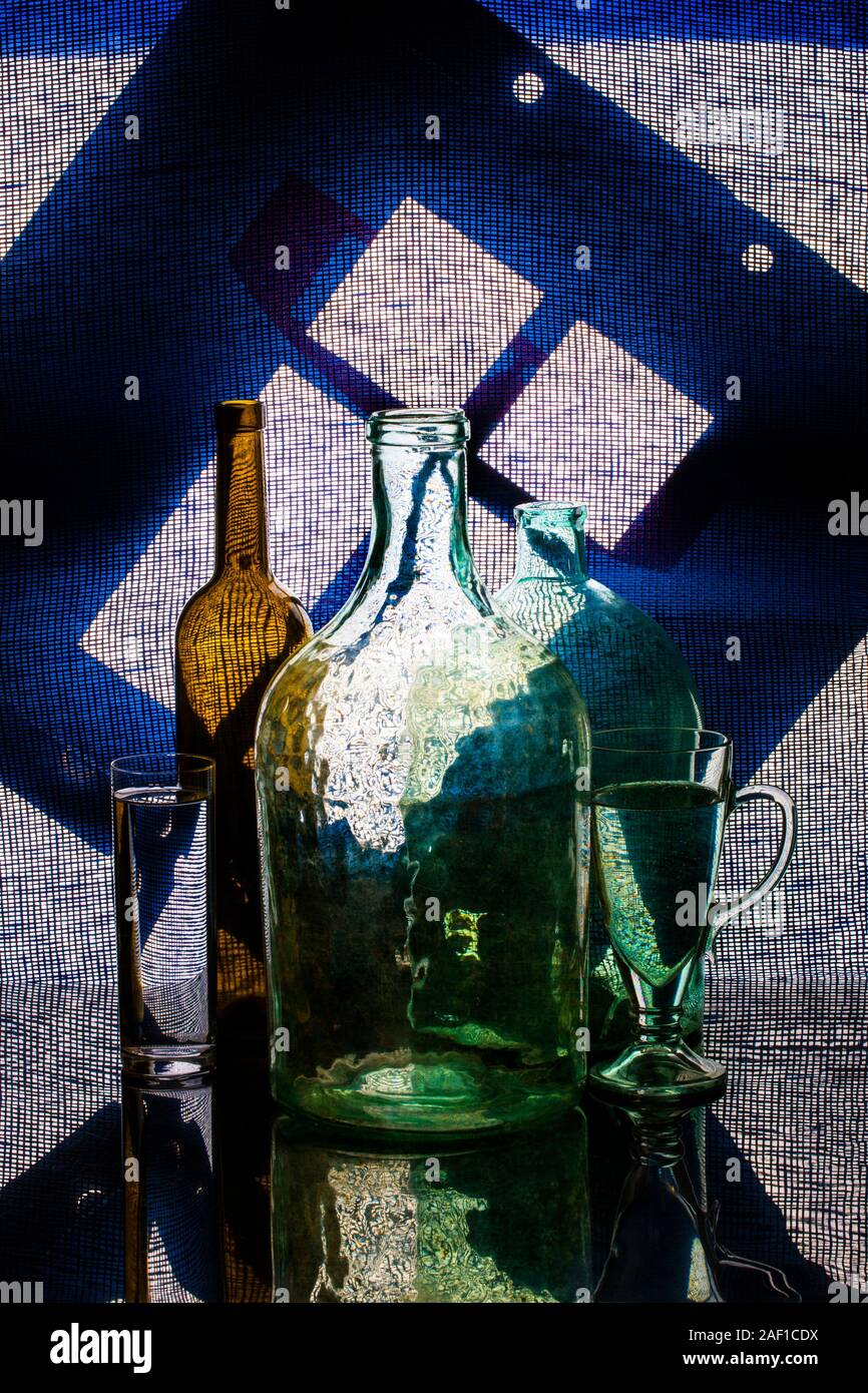 Still life with glass objects "Waiting for the dawn Stock Photo - Alamy