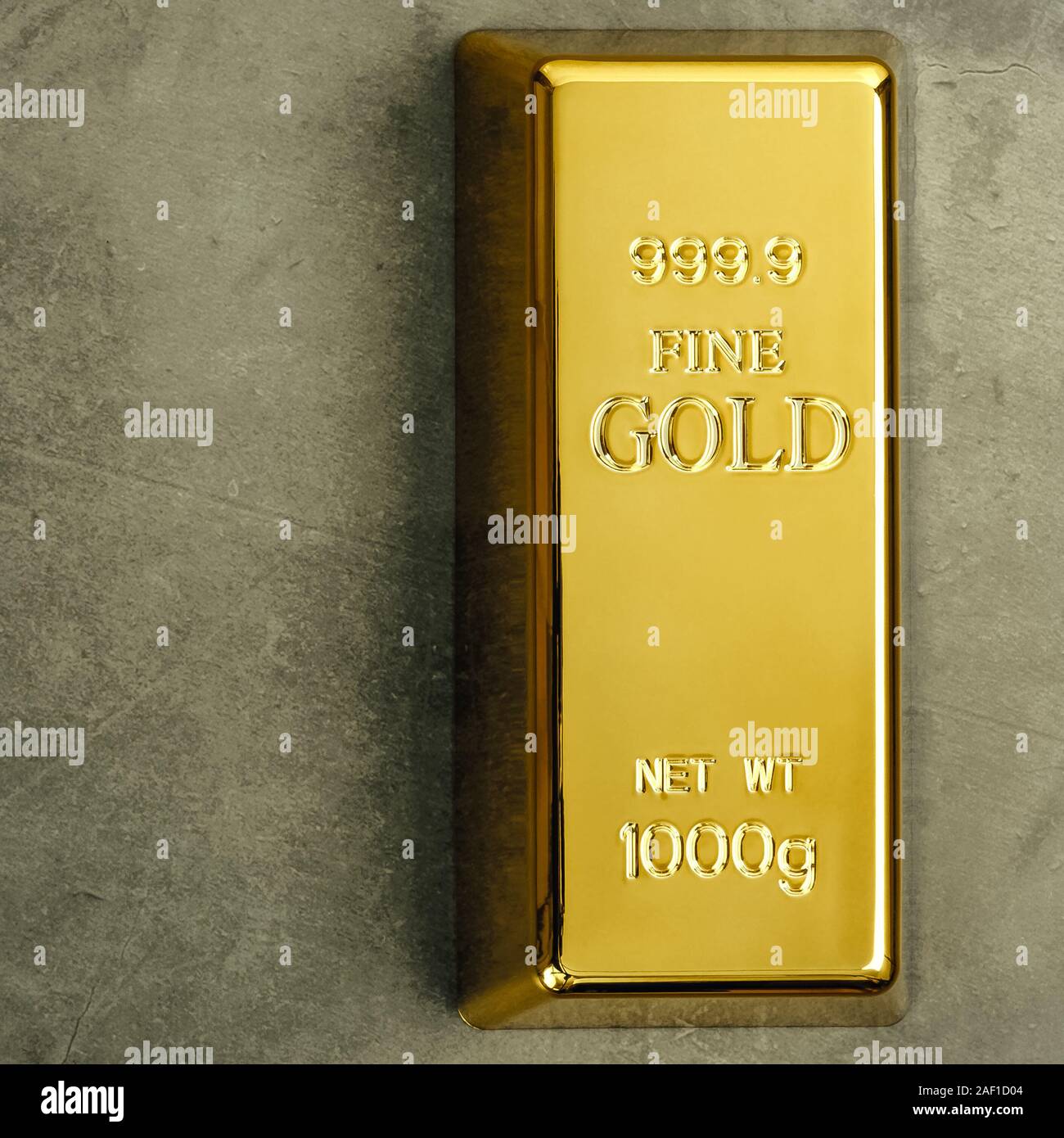 Ingot of pure gold metal bullion on a gray textured background Stock ...