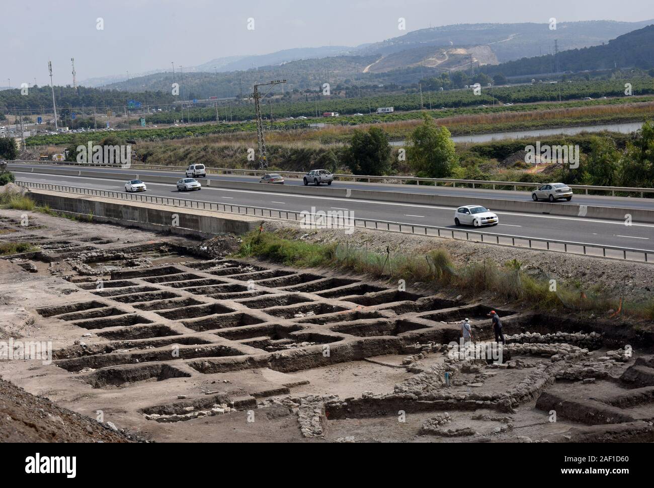 En Esur, Israel. 12th Dec, 2019. Cars drive on a highway past part of a ...