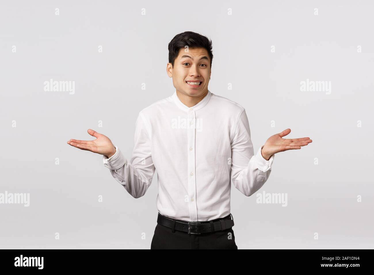 Oops sorry but cant help. Indecisive cute asian young man, businessman ...