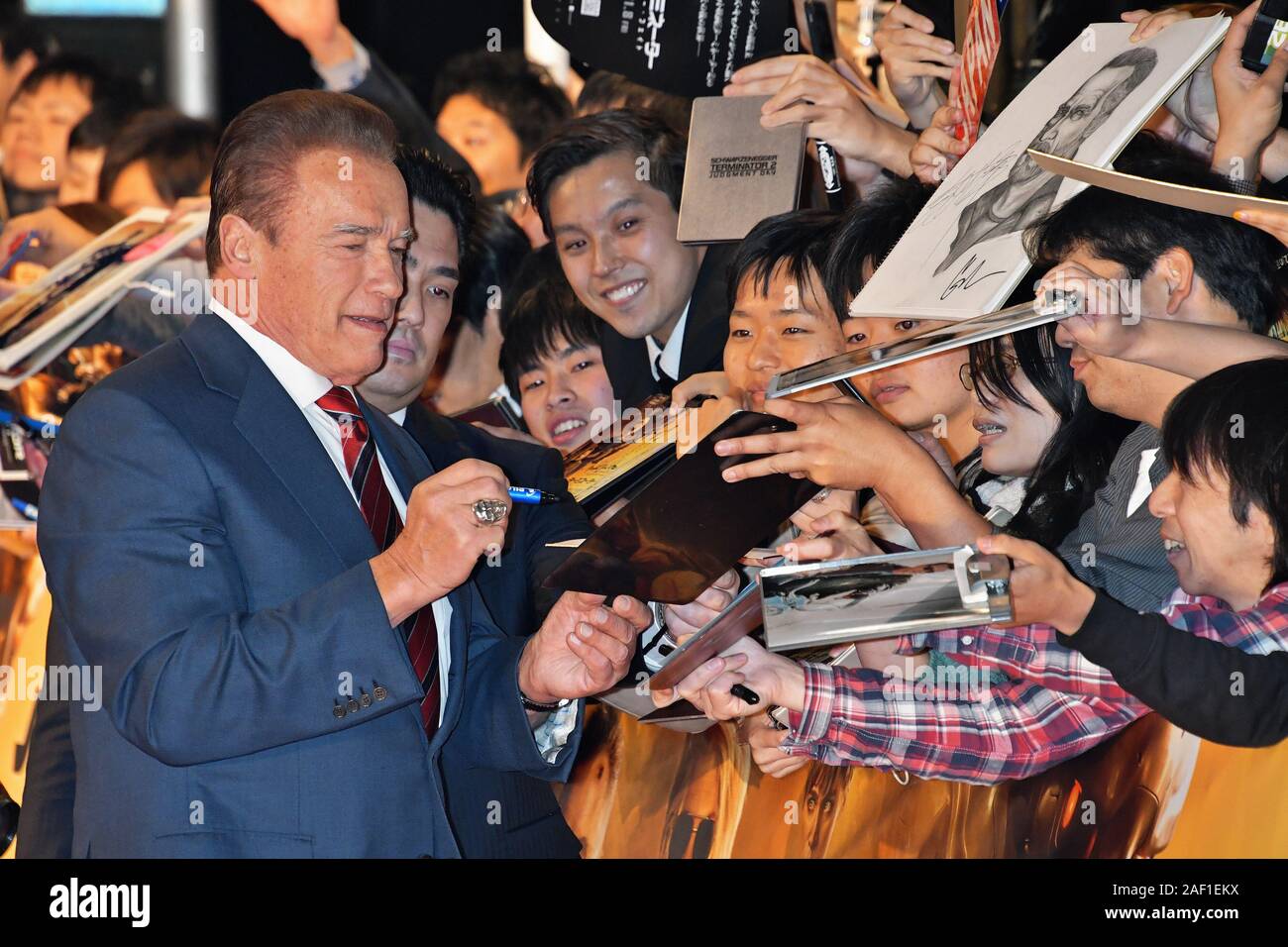 Tokyo, Japan. 12th Dec, 2019. Actor Arnold Schwarzenegger signs an ...