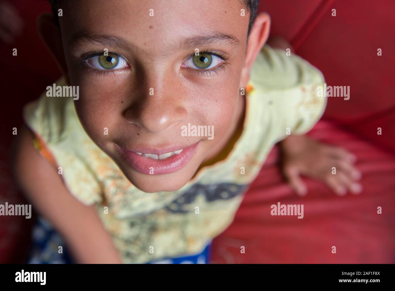 Penedo, Alagoas, Brazil - July 04, 2016: Cute Brazilian boy with green ...