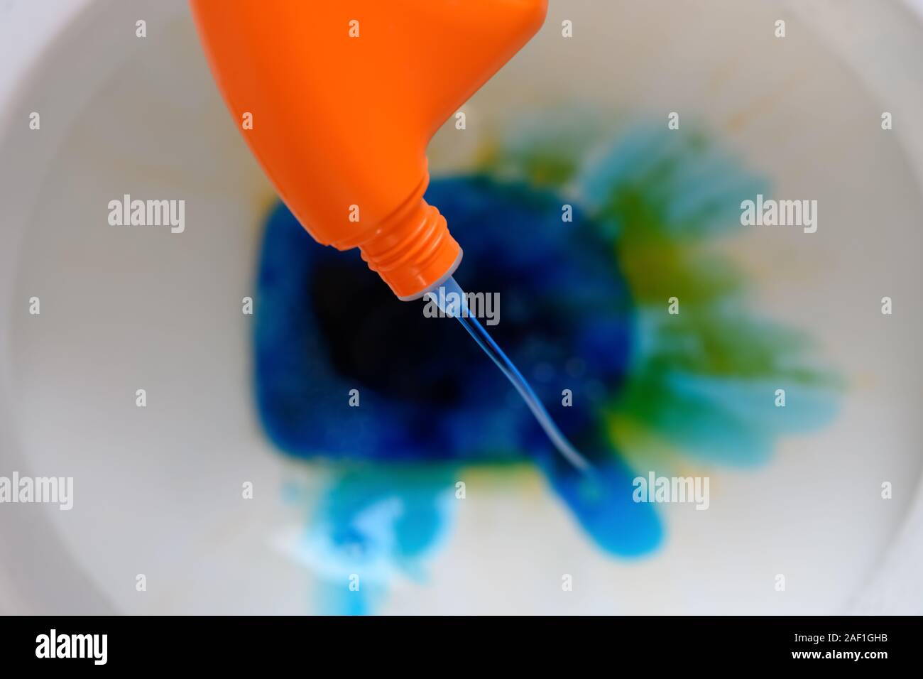 cleaning closestool with chemical liquid Stock Photo - Alamy