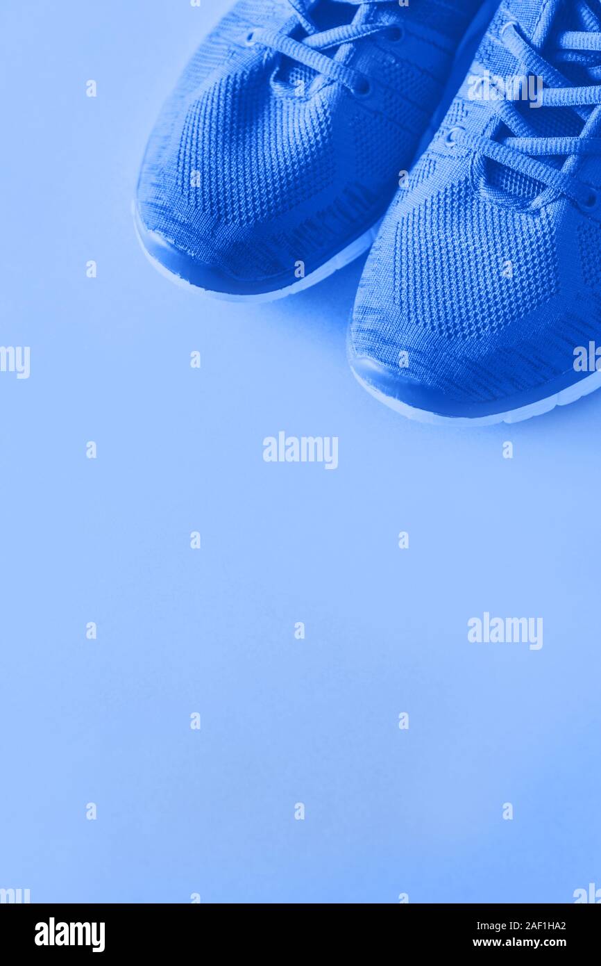 Classic blue trainers on monochrome background. Color of 2020 Stock ...