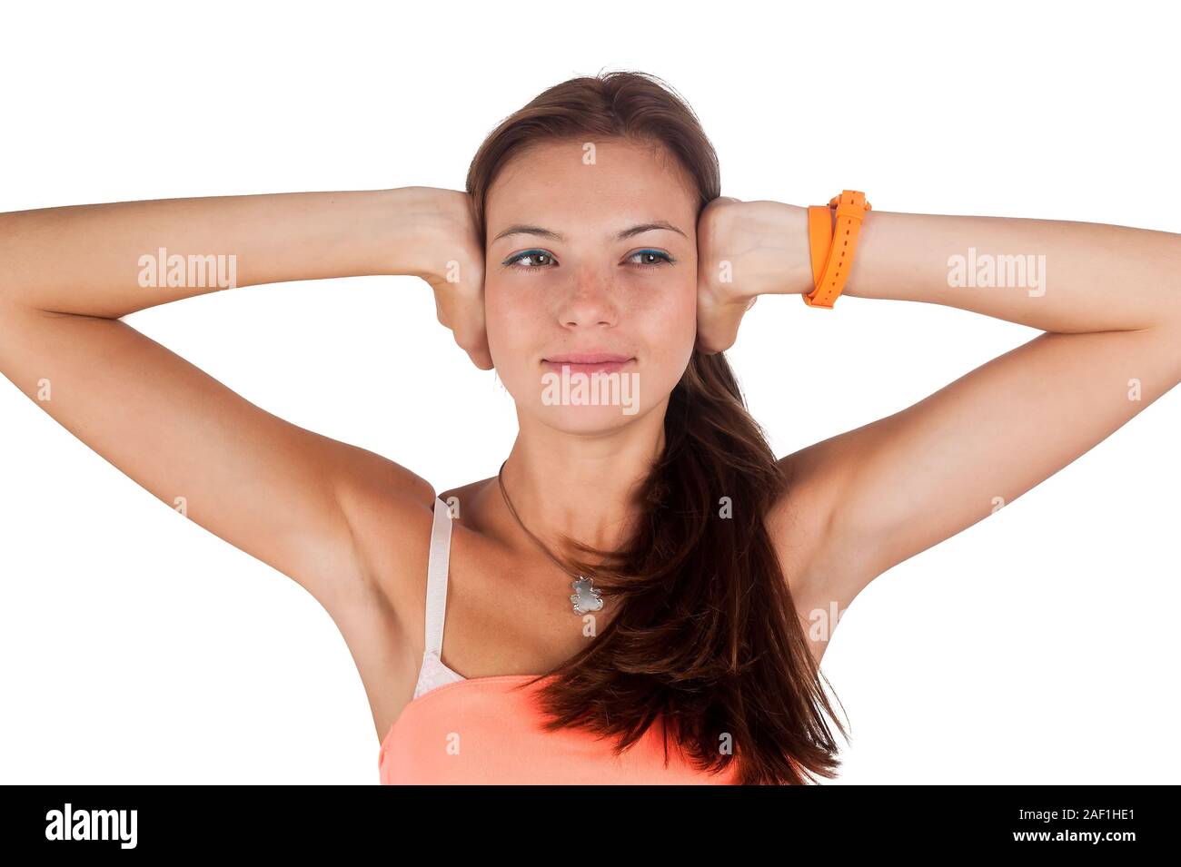 Hear no evil. Young pretty woman covering her ears Stock Photo - Alamy