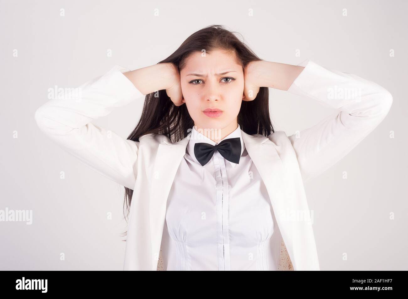 Attractive woman closing her ears Stock Photo - Alamy