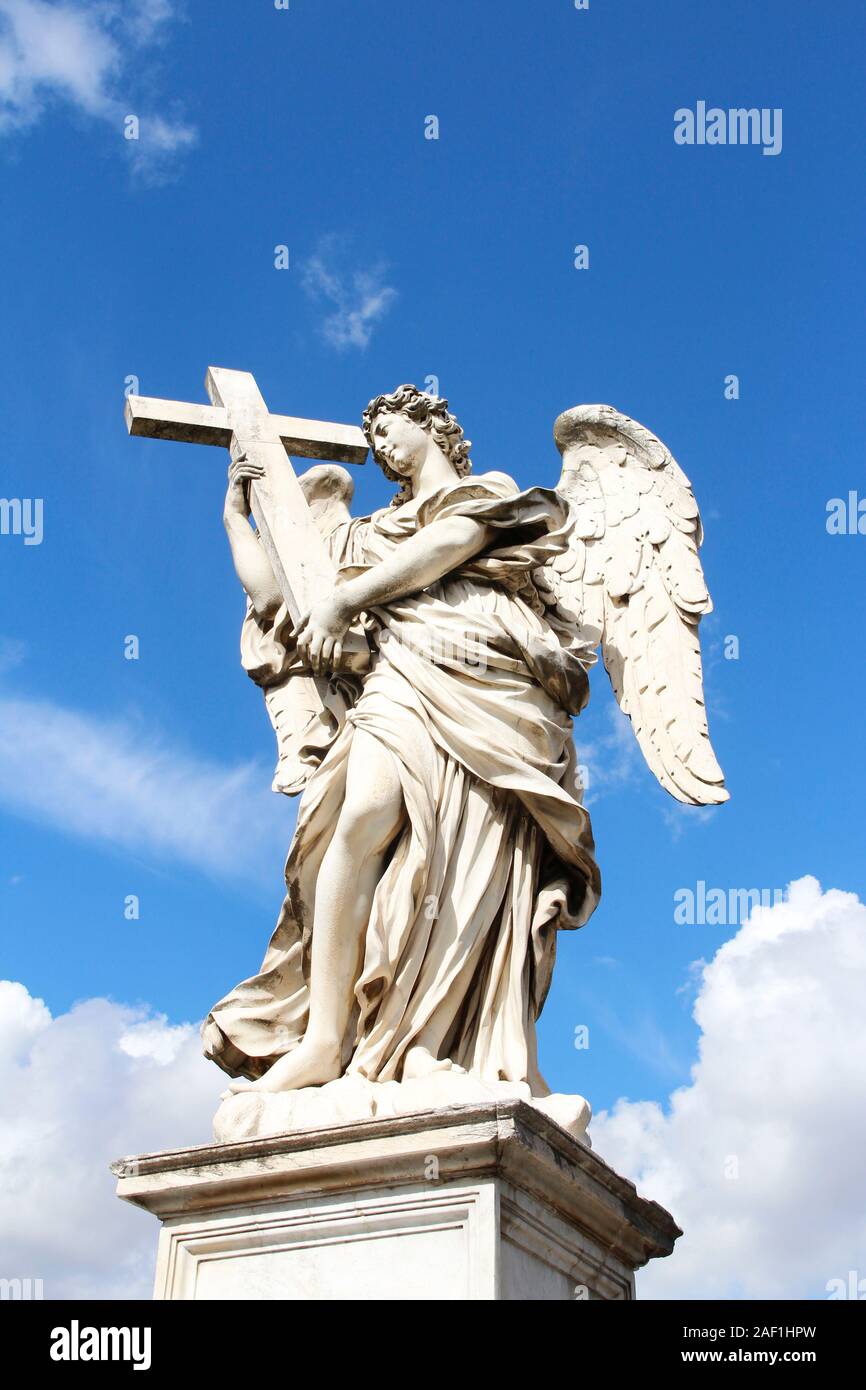 Statue of angel carrying cross hi-res stock photography and images - Alamy