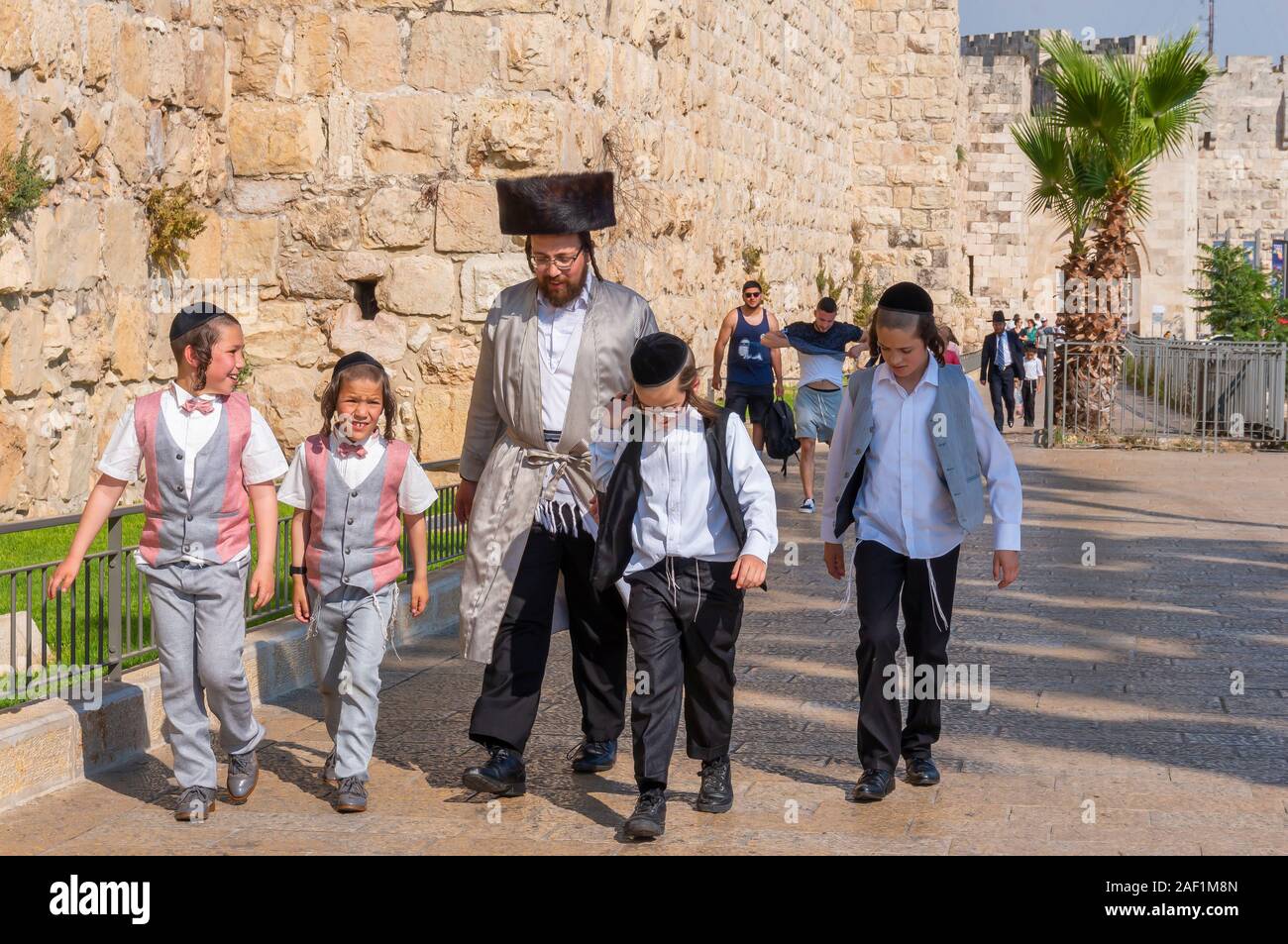 A traditional orthodox Judaic family with children in Jerusalem, Israel ...