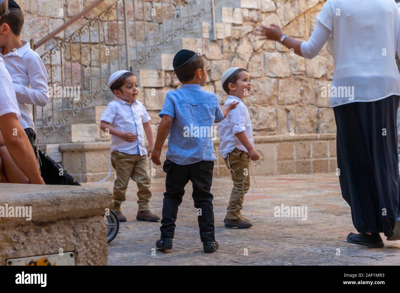 A traditional orthodox Judaic family with children in Jerusalem, Israel ...