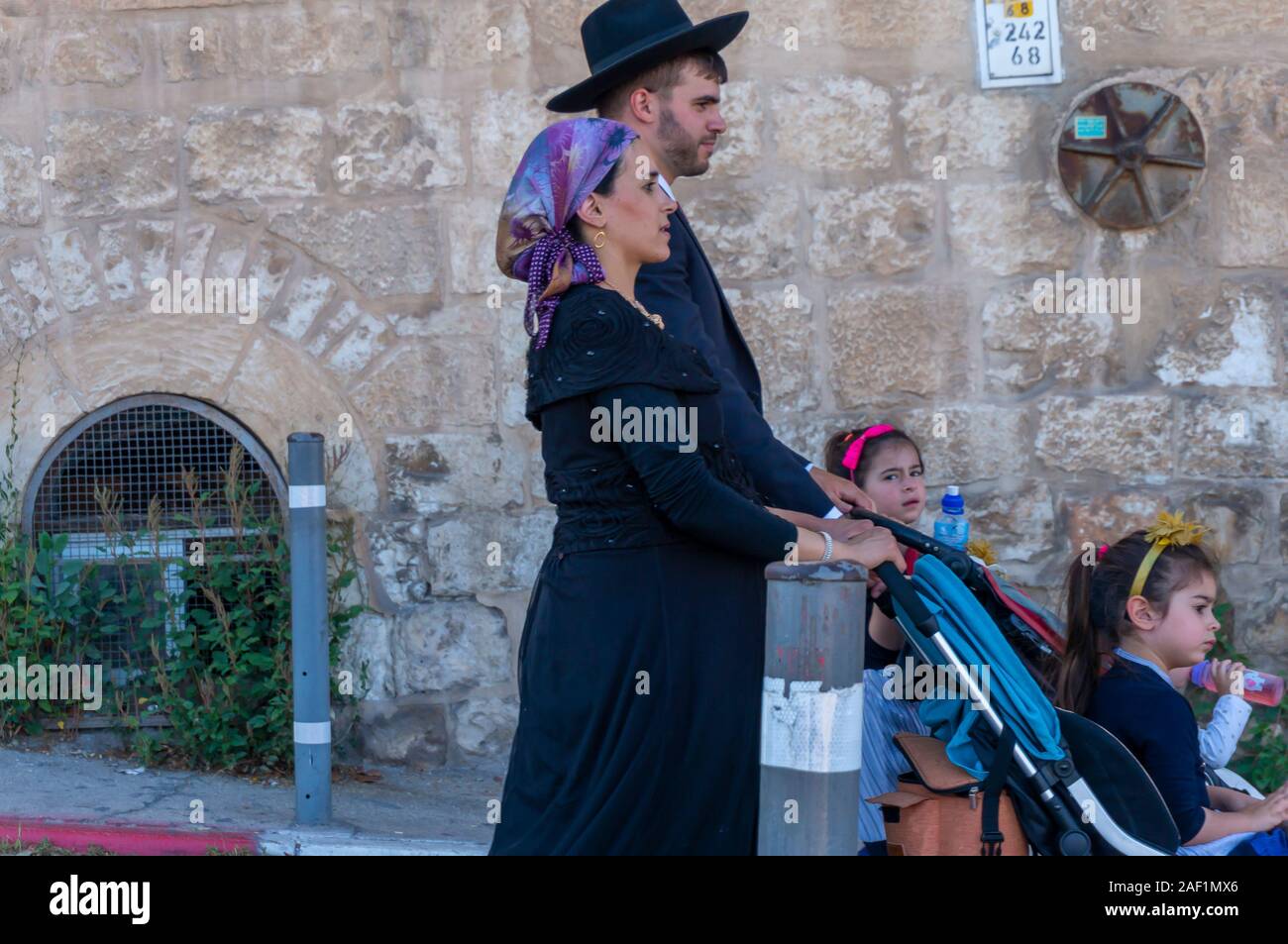 A traditional orthodox Judaic family with children in Jerusalem, Israel ...