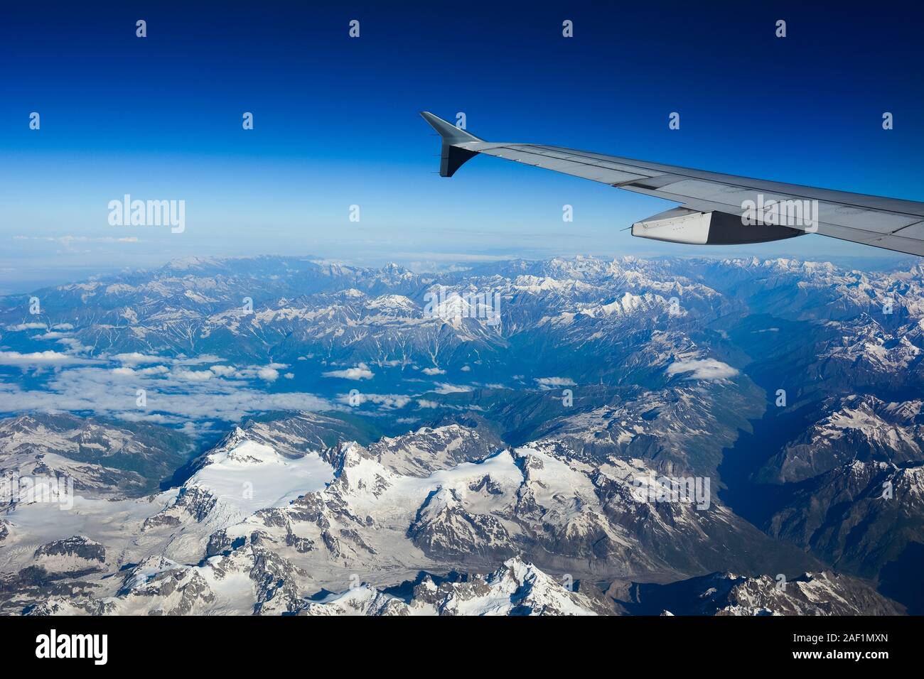 View from airplane window to Hymalaya Mountains and clouds. Travel to ...