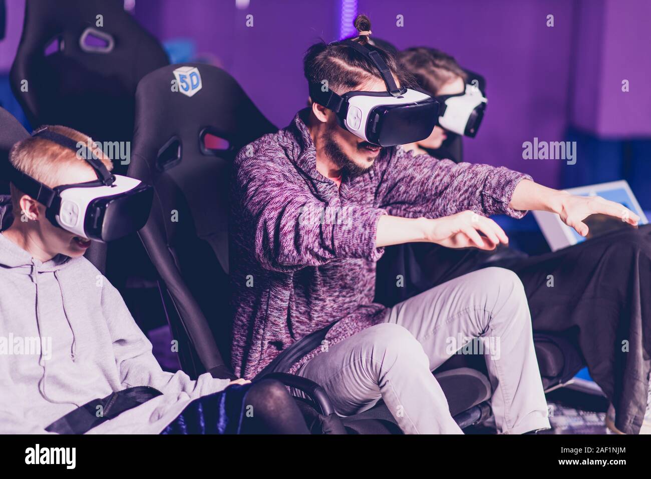 friends in virtual glasses watching movies in the cinema with special ...