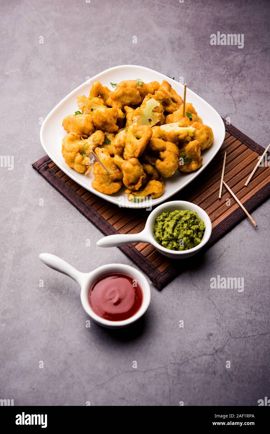 Gobi pakora or Phoolgobi pakoda made using fresh cauliflower dipped ...