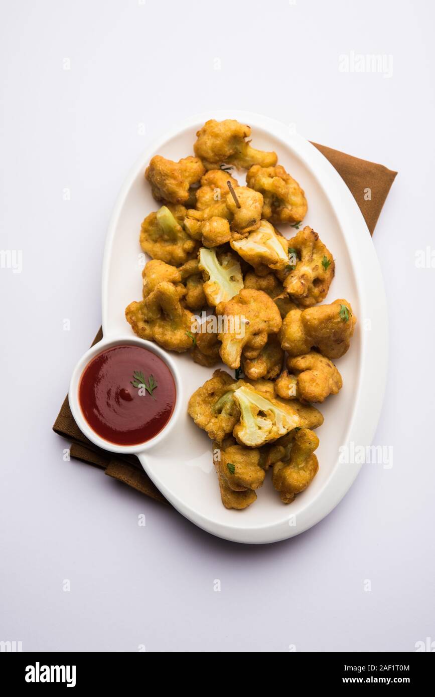 Gobi pakora or Phoolgobi pakoda made using fresh cauliflower dipped ...