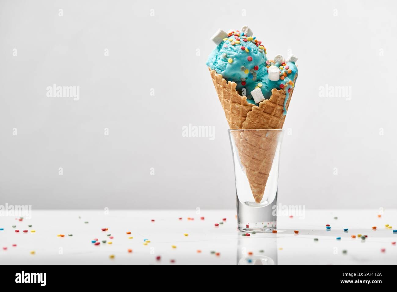 delicious sweet blue ice cream with marshmallows and sprinkles in ...