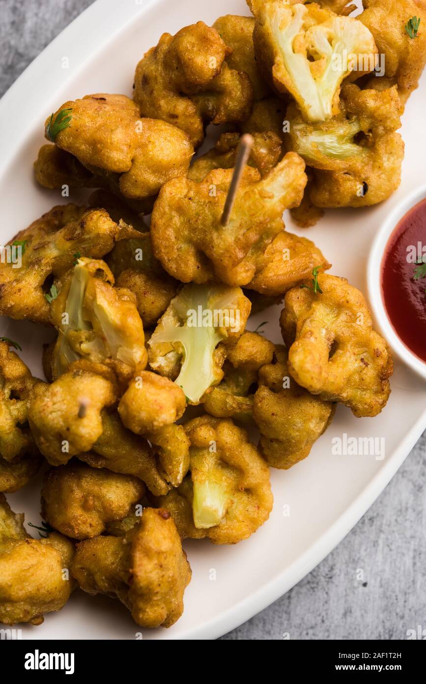 Gobi pakora or Phoolgobi pakoda made using fresh cauliflower dipped ...