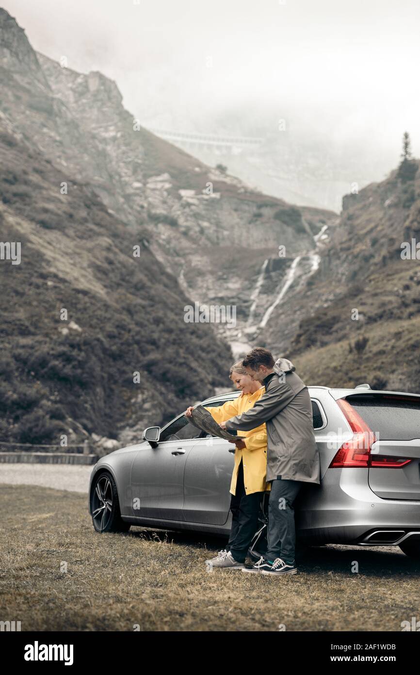 Mature woman standing near car hi-res stock photography and images - Alamy