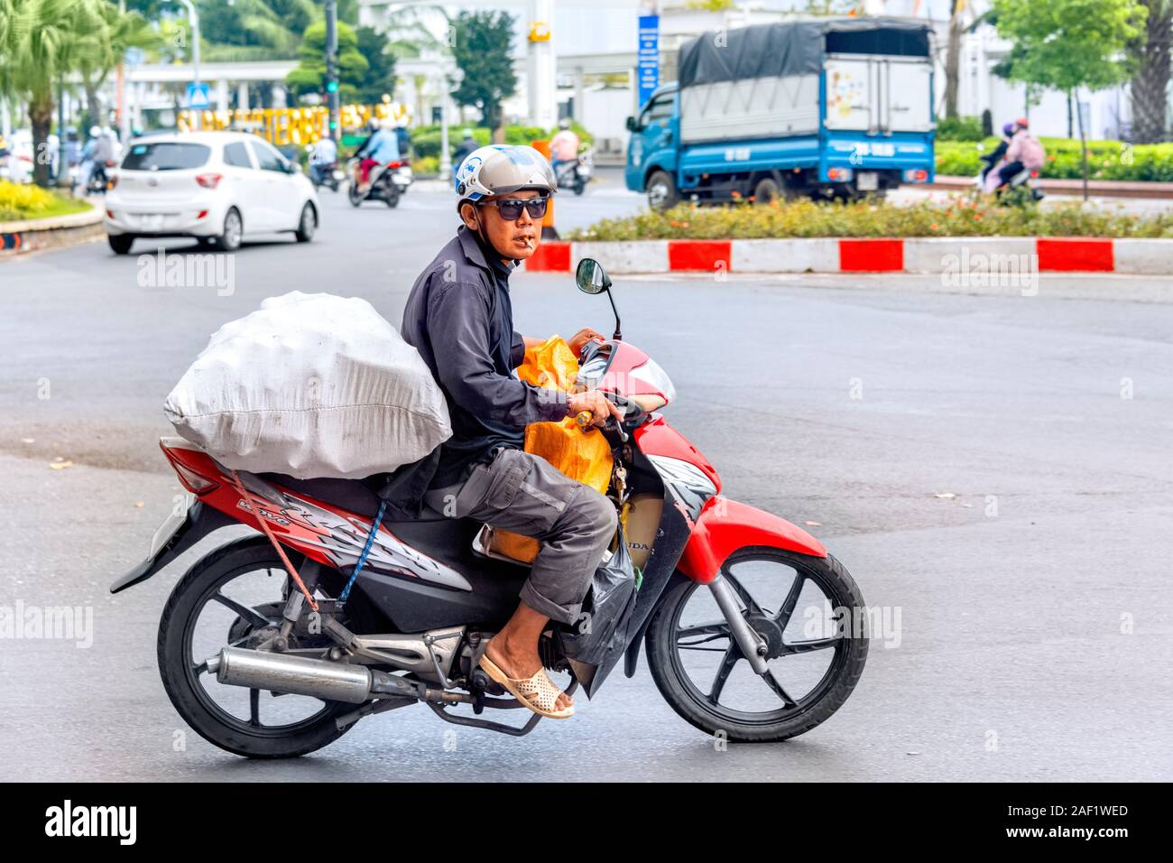 Man riding loaded motorcycle saigon hi-res stock photography and images ...