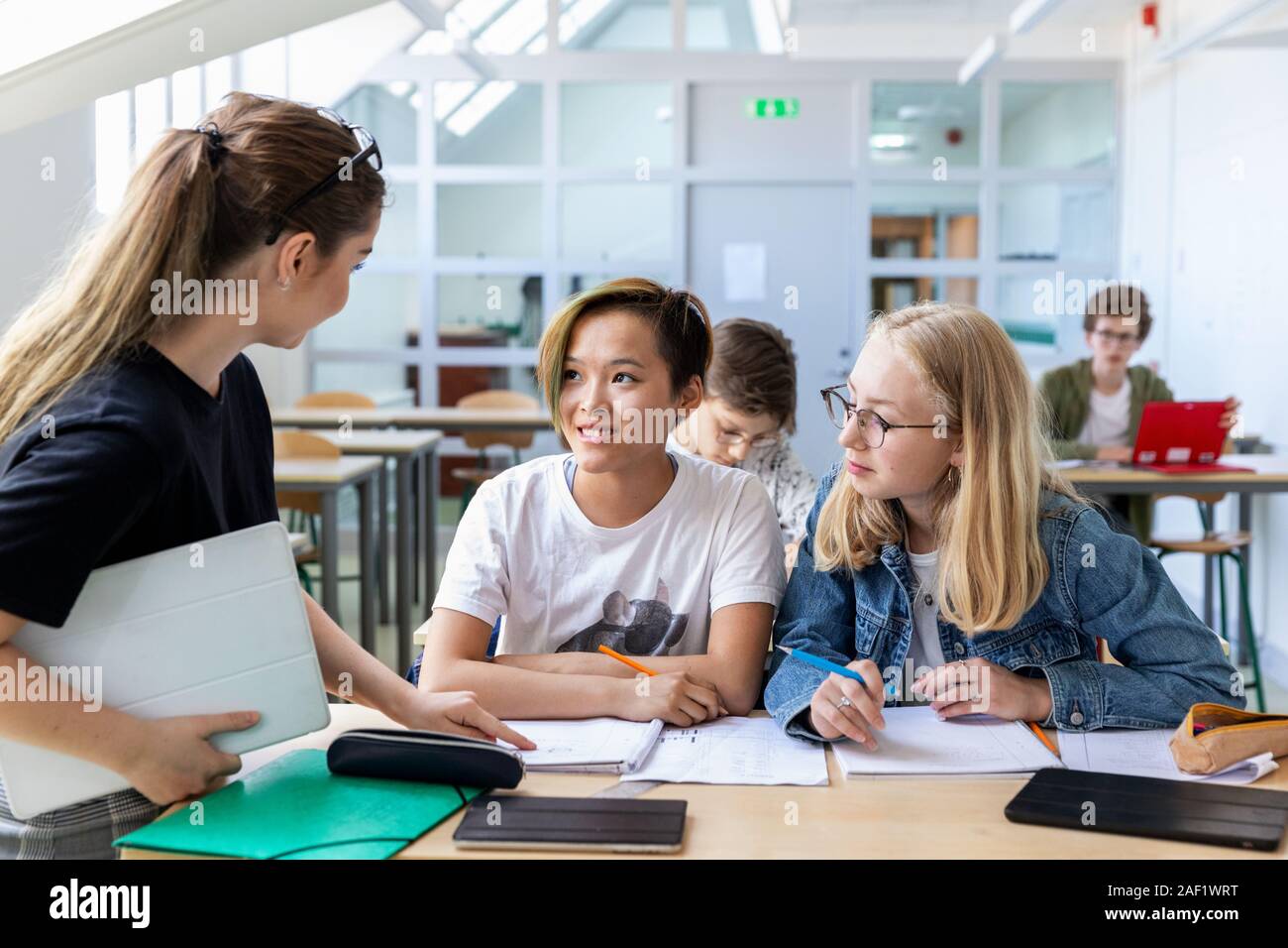 Teenage girls in classroom Stock Photo - Alamy