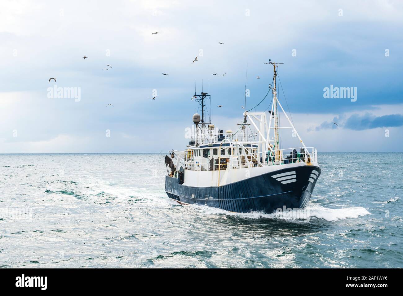 Fishing boat at sea Stock Photo - Alamy