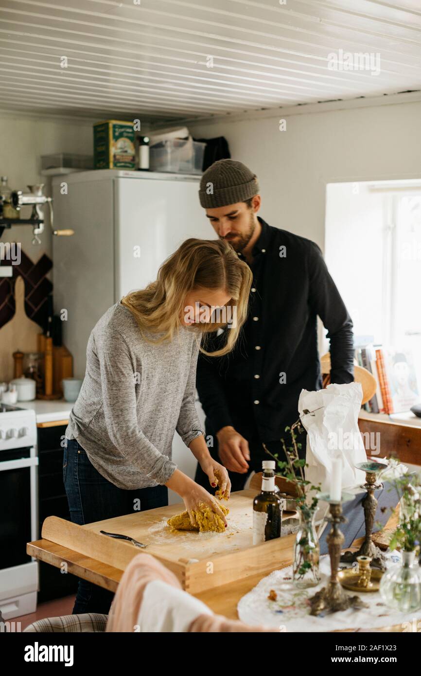 Couple preparing food Stock Photo - Alamy