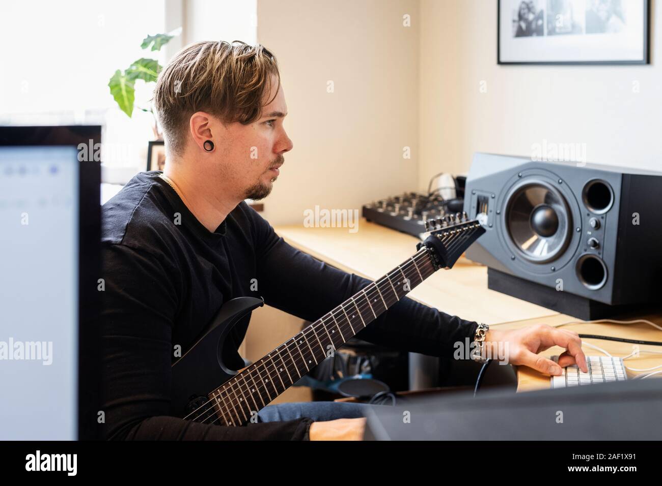 Musician working on computer Stock Photo - Alamy