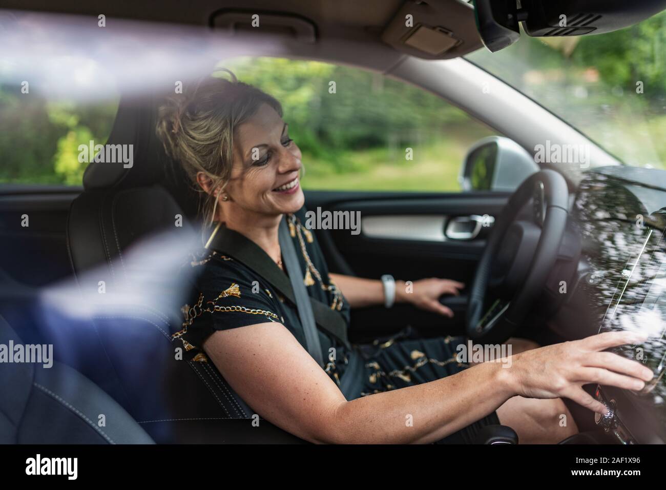 Woman driving car Stock Photo - Alamy