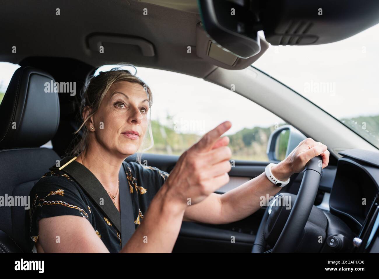 Car mature woman driving hi-res stock photography and images - Alamy
