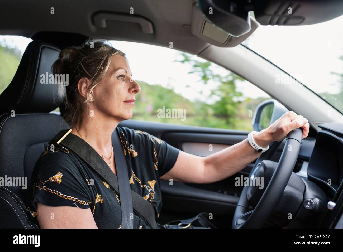 Woman driving car Stock Photo - Alamy