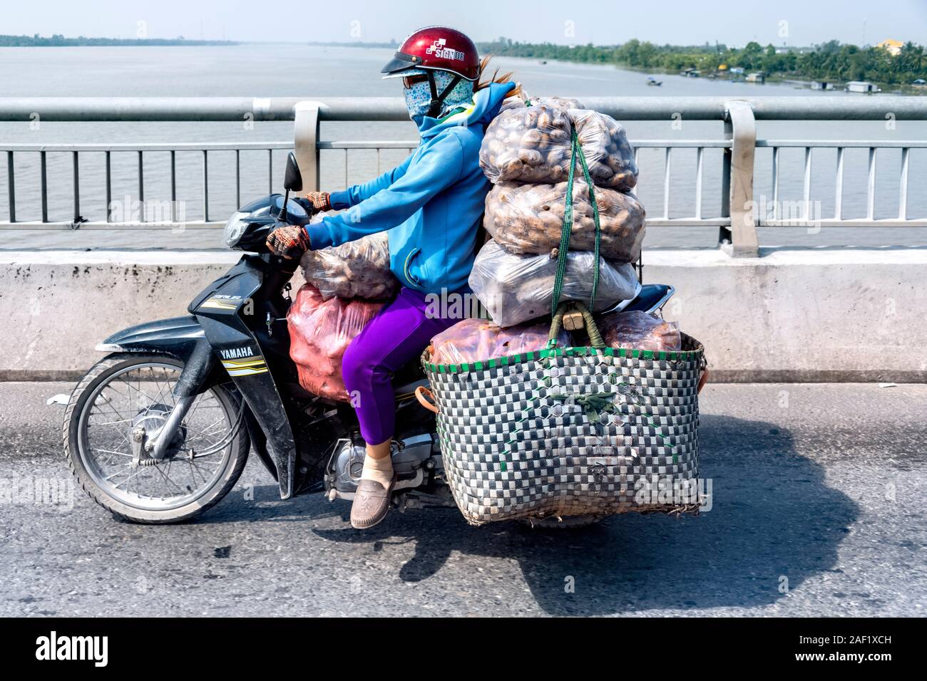 Lady on moped loaded with goods Ho Chi Minh City Vietnam Stock Photo ...