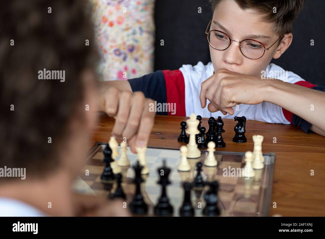 Boy playing chess Stock Photo - Alamy
