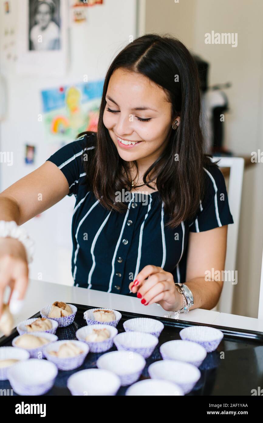 Teenage girl baking in kitchen Stock Photo - Alamy
